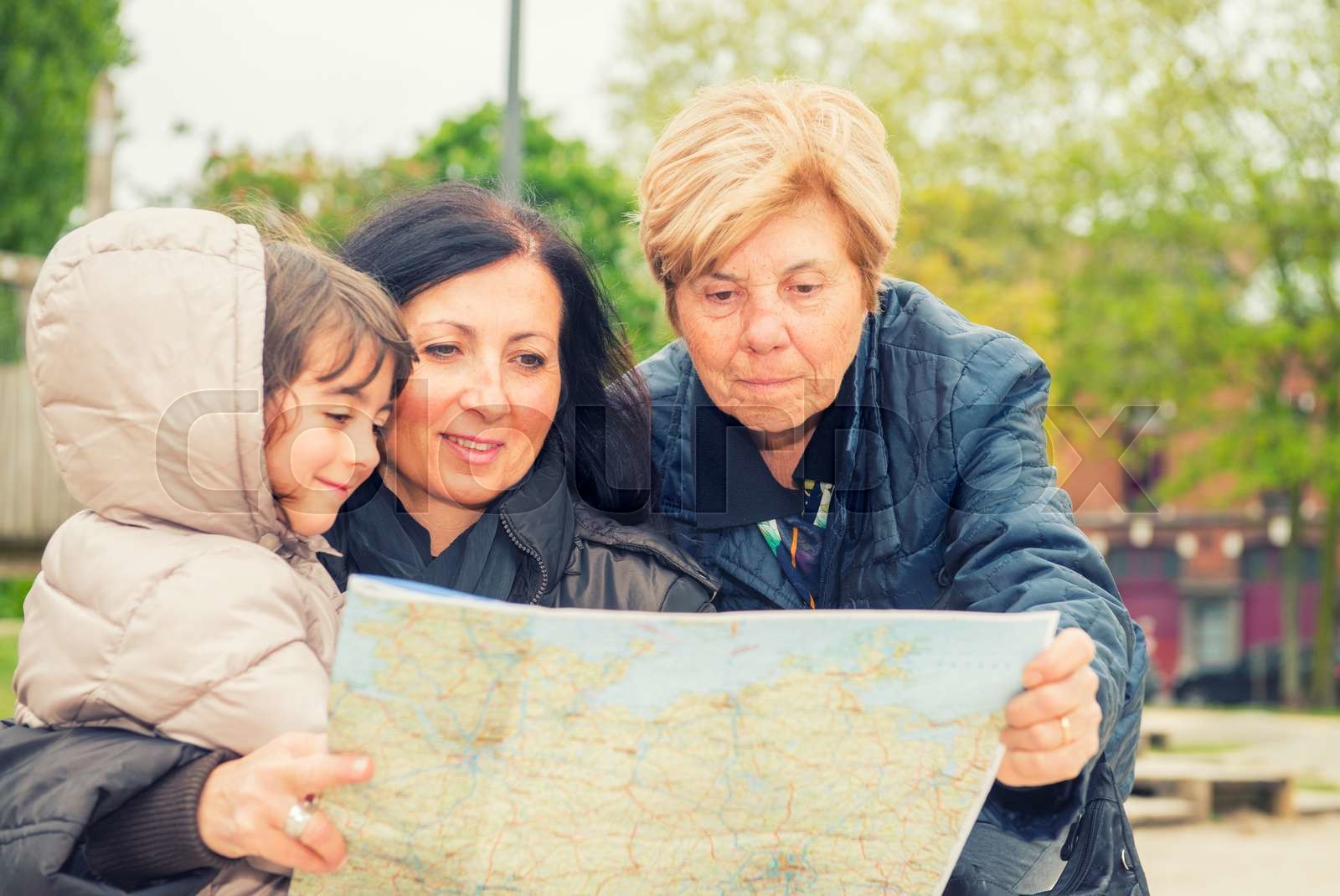 Tourism concept. Three generations visiting city. Girl with mother and ...