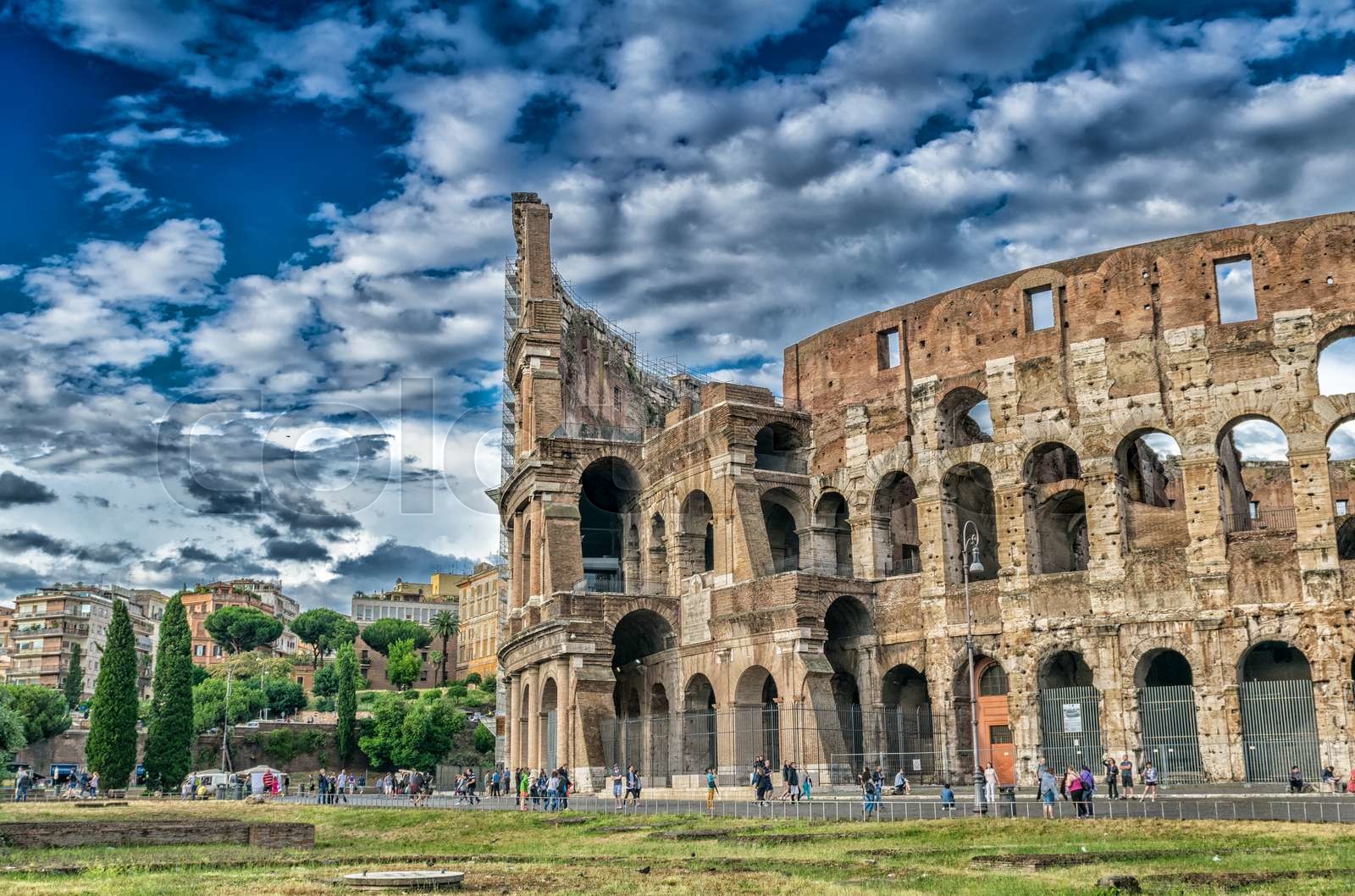 ROME - MAY 20, 2014: Tourists visit Colosseum. The city is visited by ...