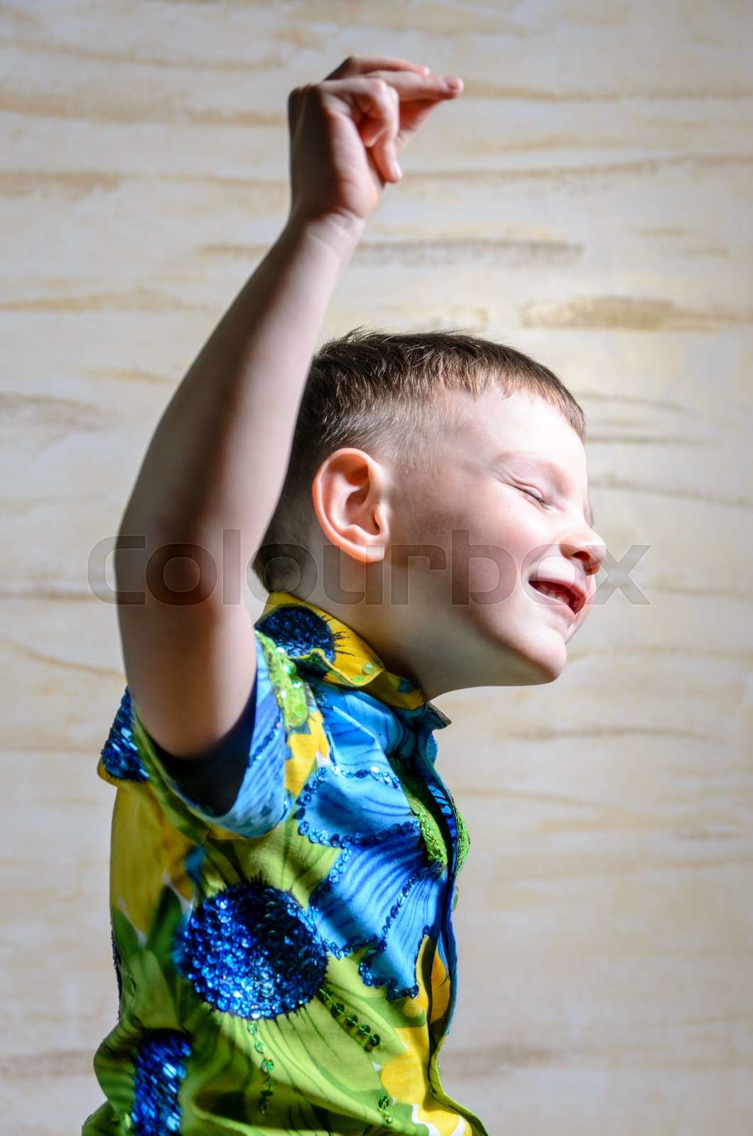 Young Boy Dancing and Snapping Fingers | Stock image | Colourbox