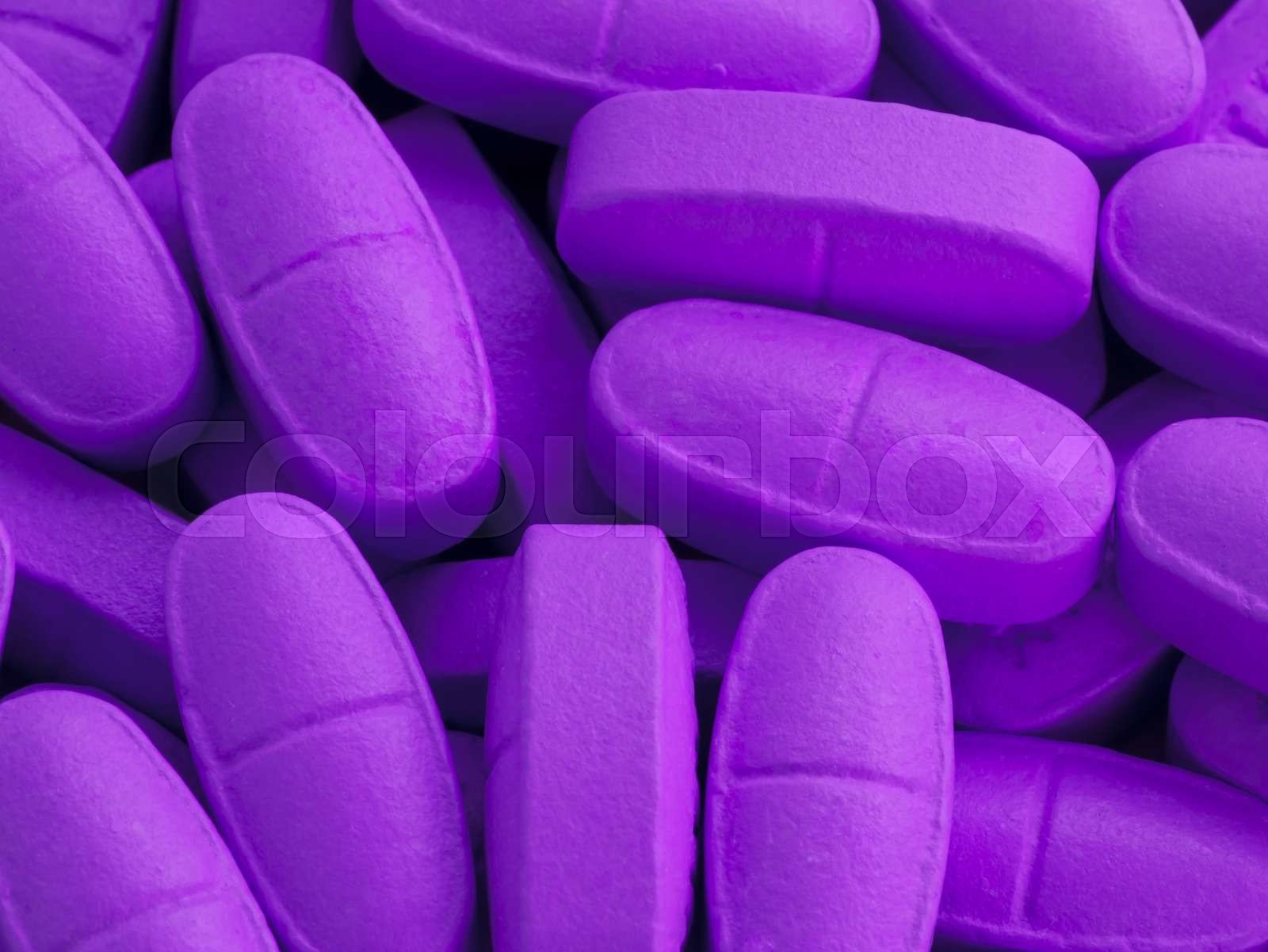 violet pills | Stock image | Colourbox
