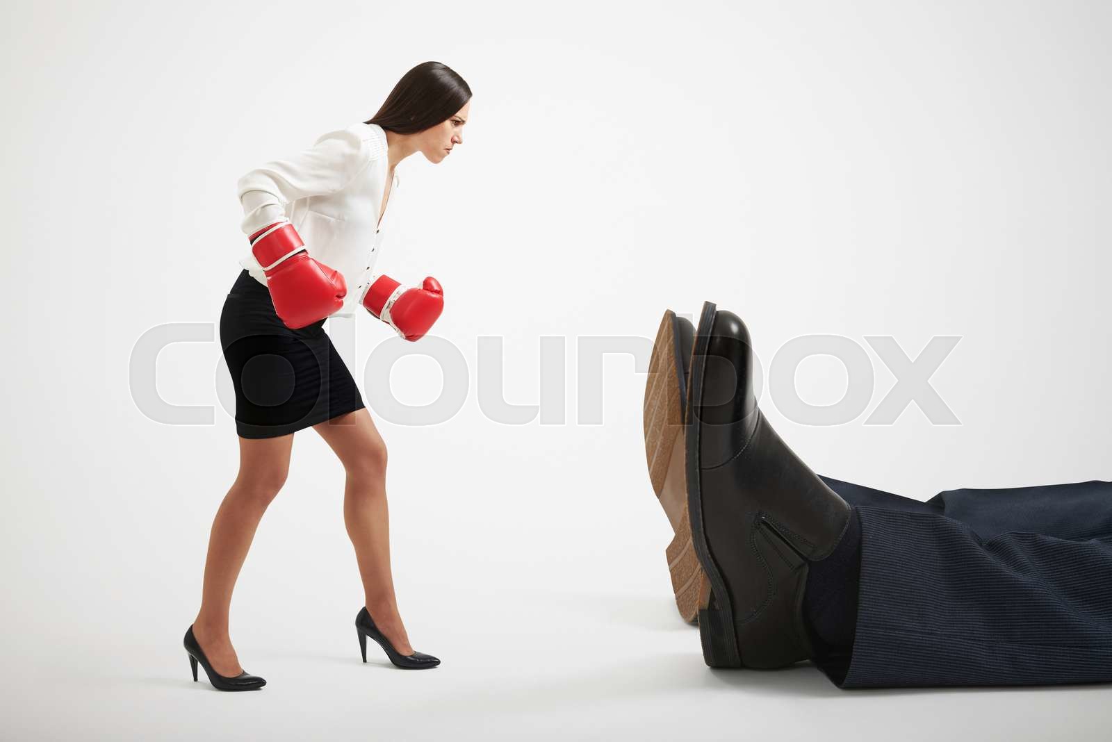 woman looking at big knocked out man | Stock image | Colourbox