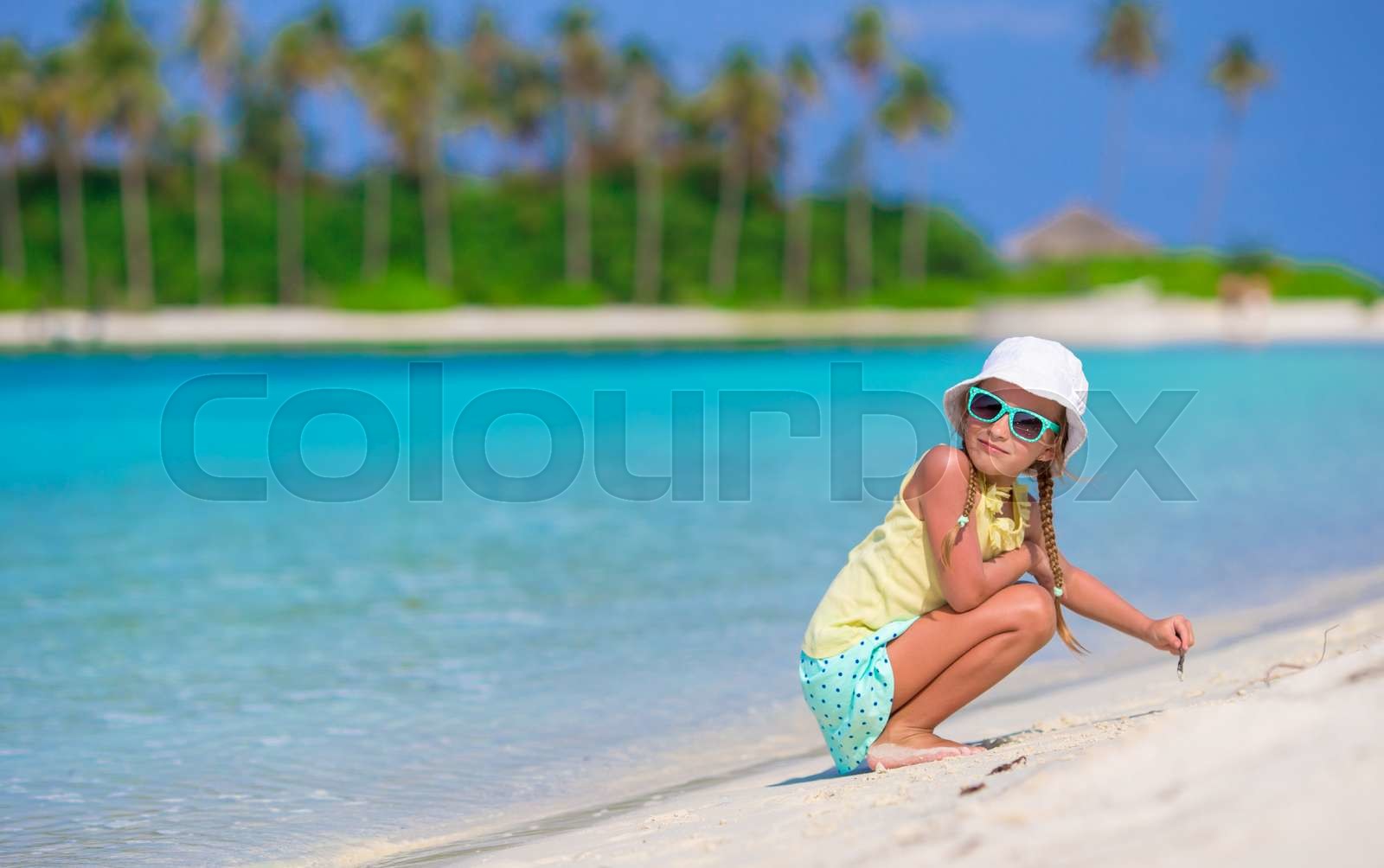 Adorable little girl at beach during summer vacation | Stock image ...