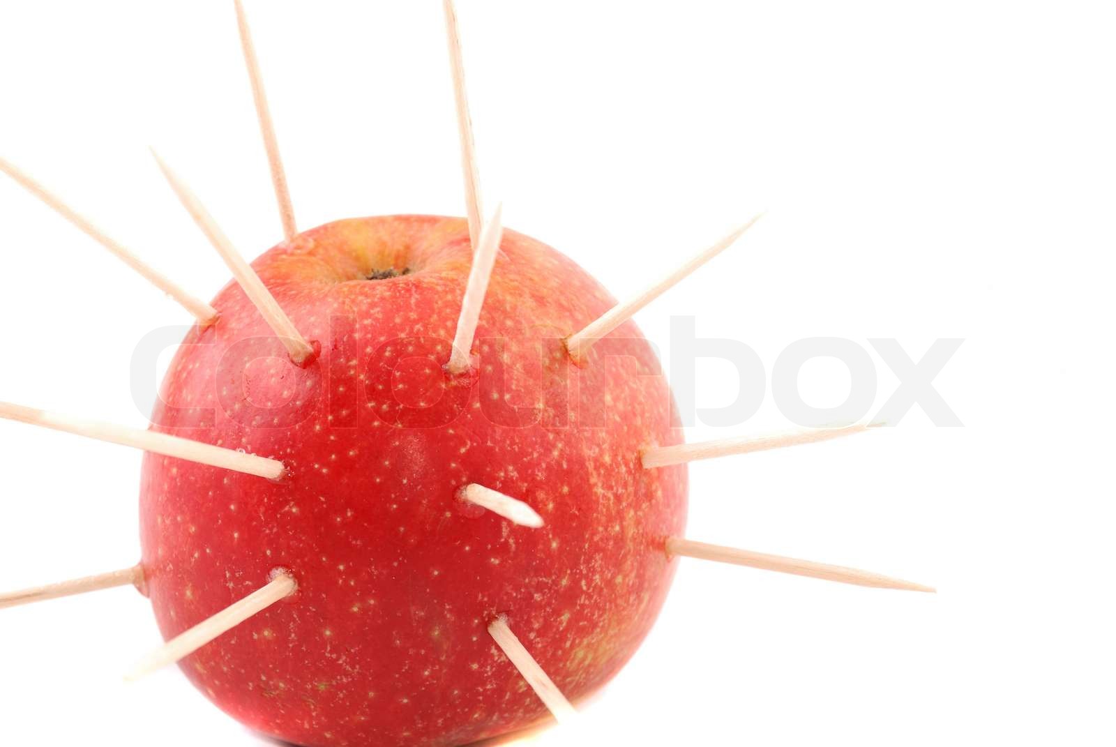 Apple with toothpicks which in it are thrust | Stock image | Colourbox
