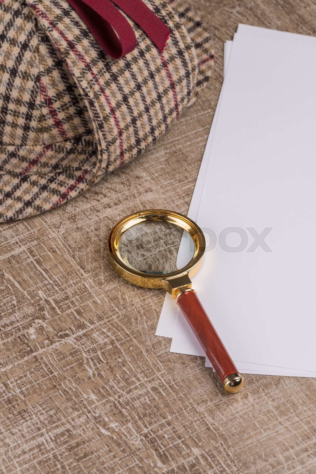 Paper sheets and magnifying glass | Stock image | Colourbox
