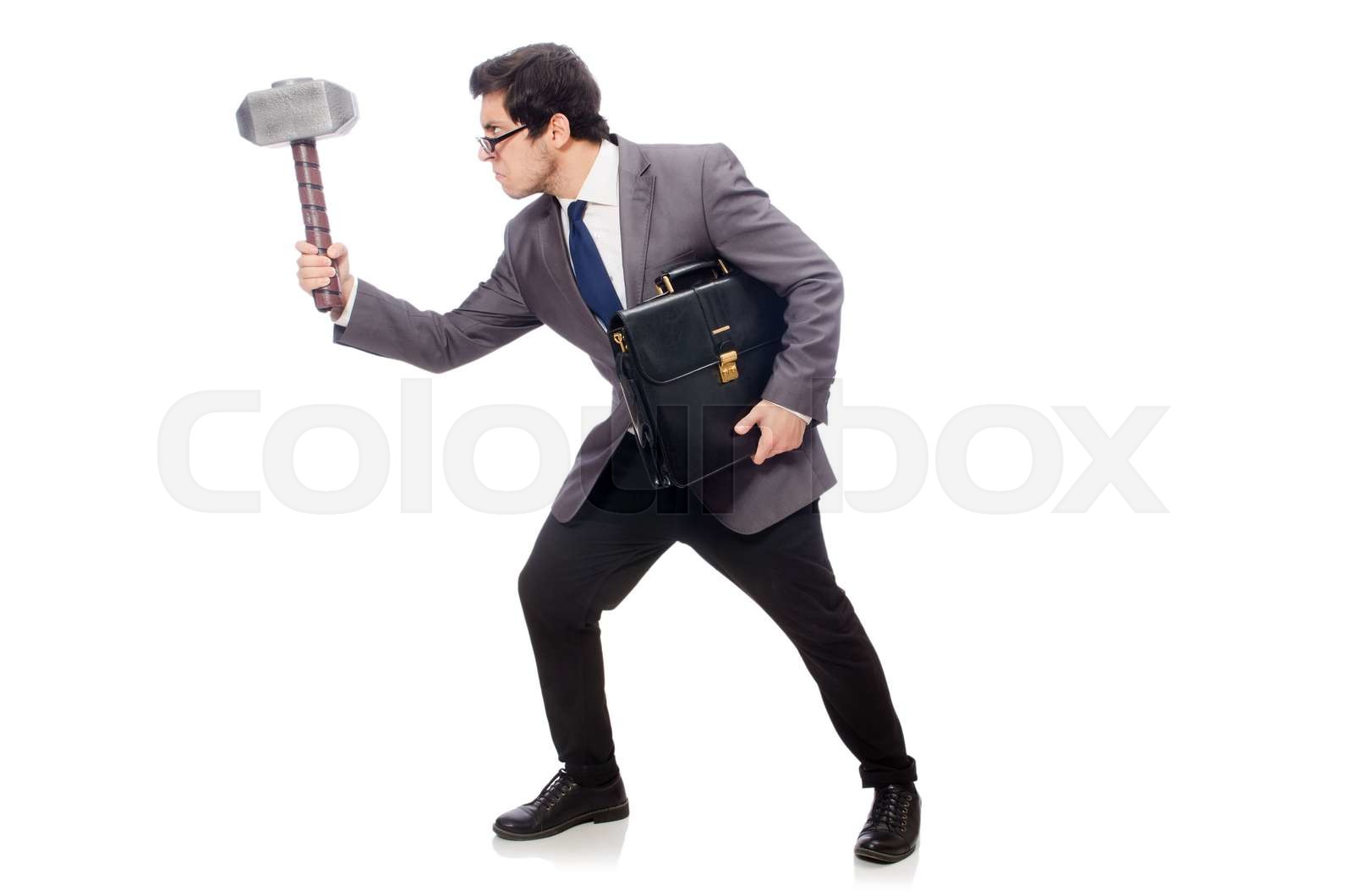 Business man holding hammer isolated on white | Stock image | Colourbox