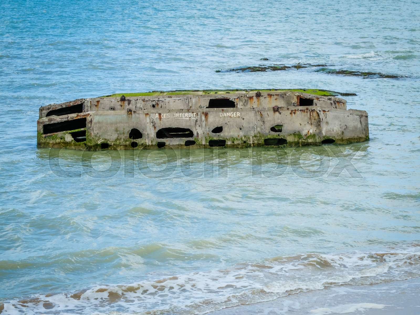 Mulberry harbor ruins of WWII in Arromanches Normandy France | Stock ...