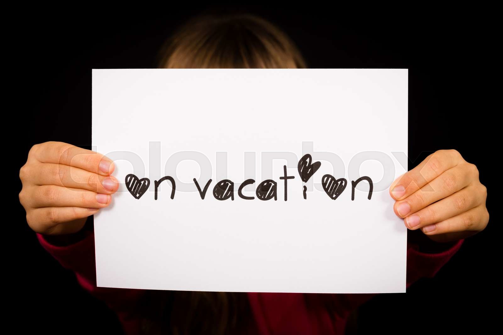 Person holding On Vacation sign | Stock image | Colourbox