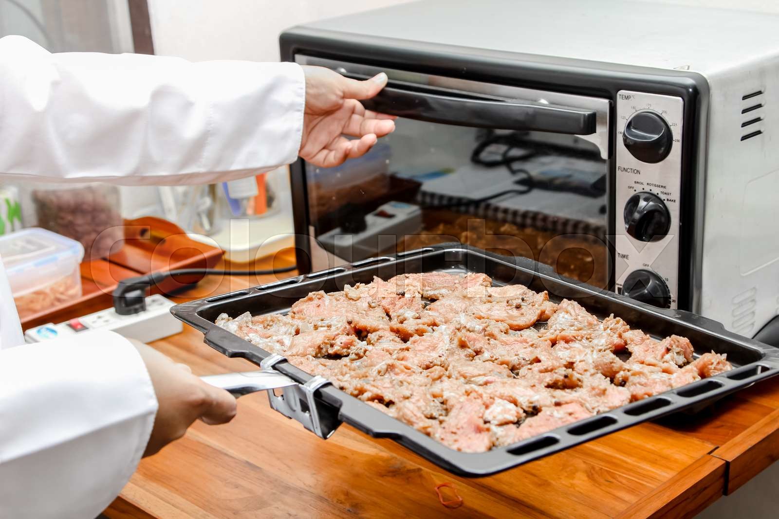 using oven | Stock image | Colourbox