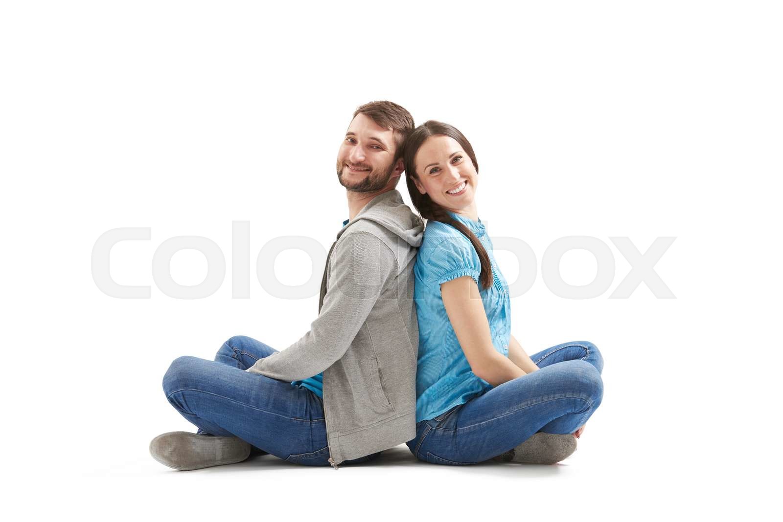 couple sitting back to back | Stock image | Colourbox