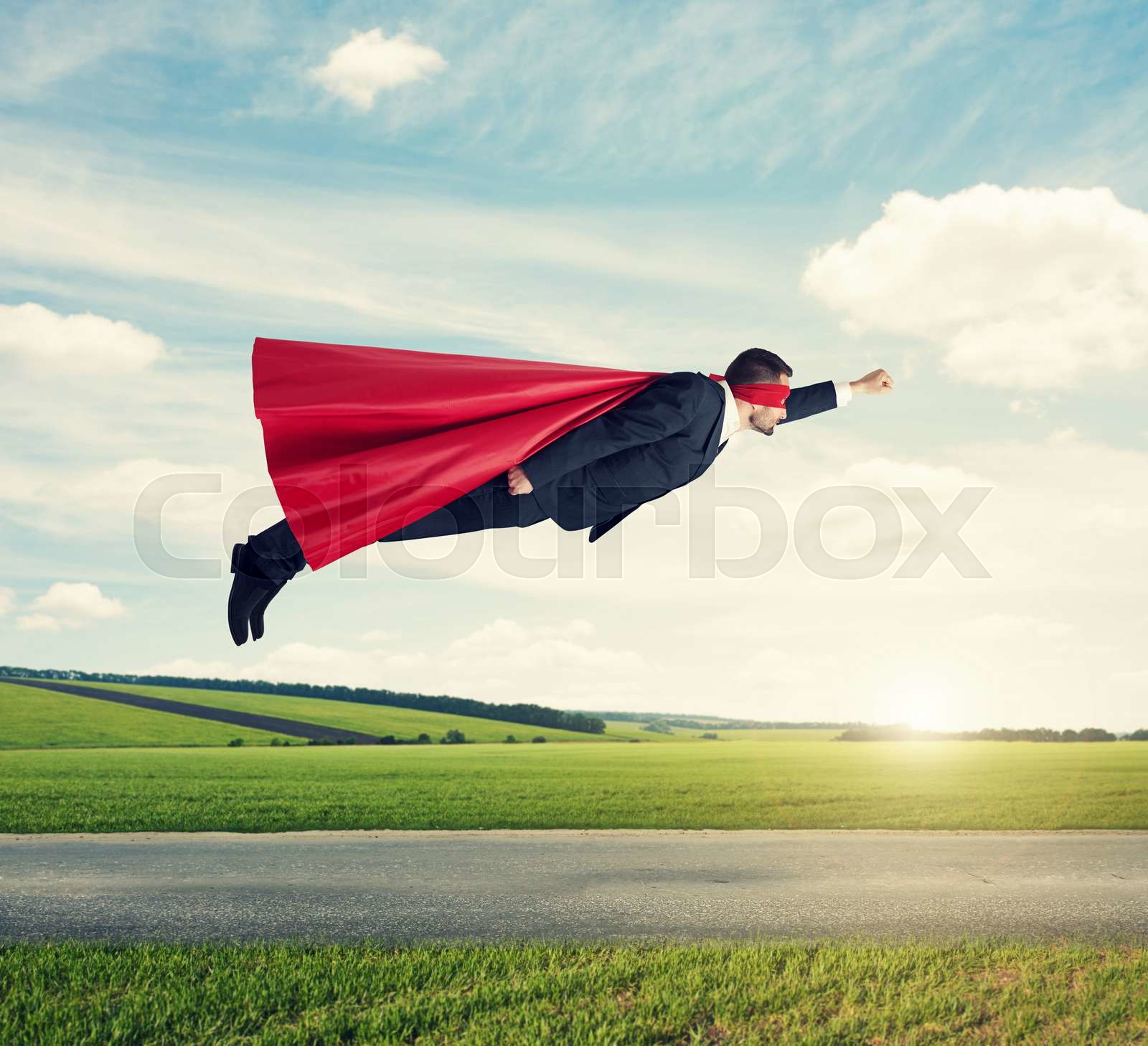 man dressed as a superhero flying | Stock image | Colourbox