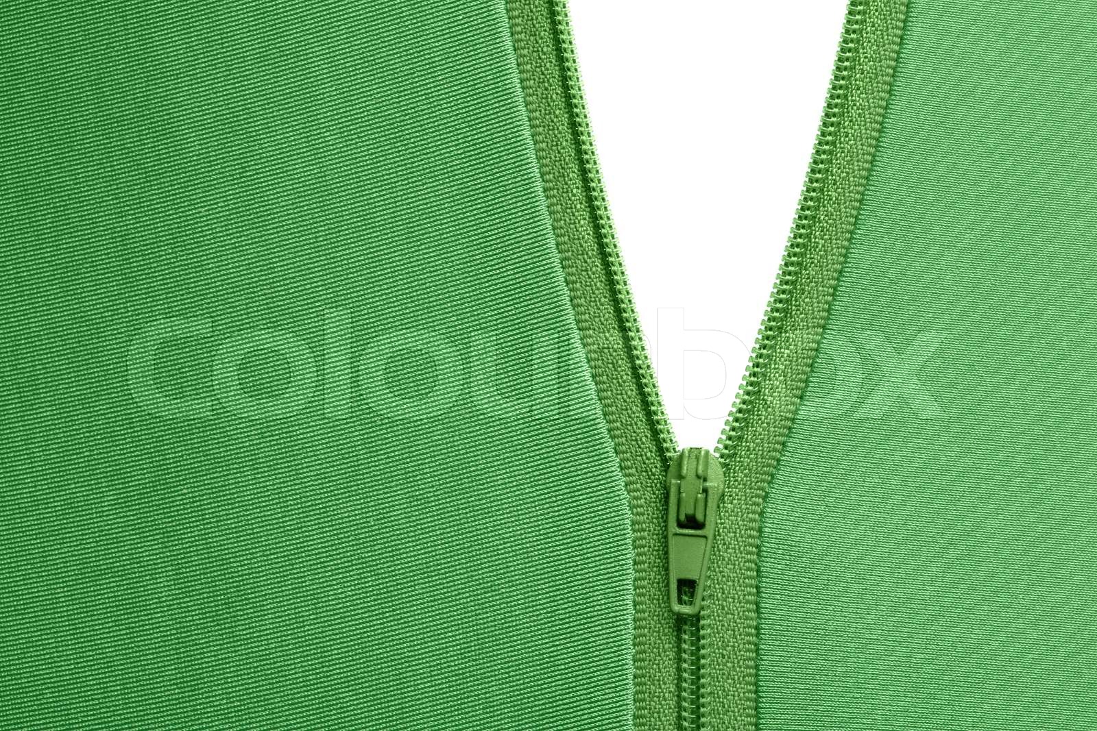 Zipper of a green garment revealing a white surface | Stock image ...