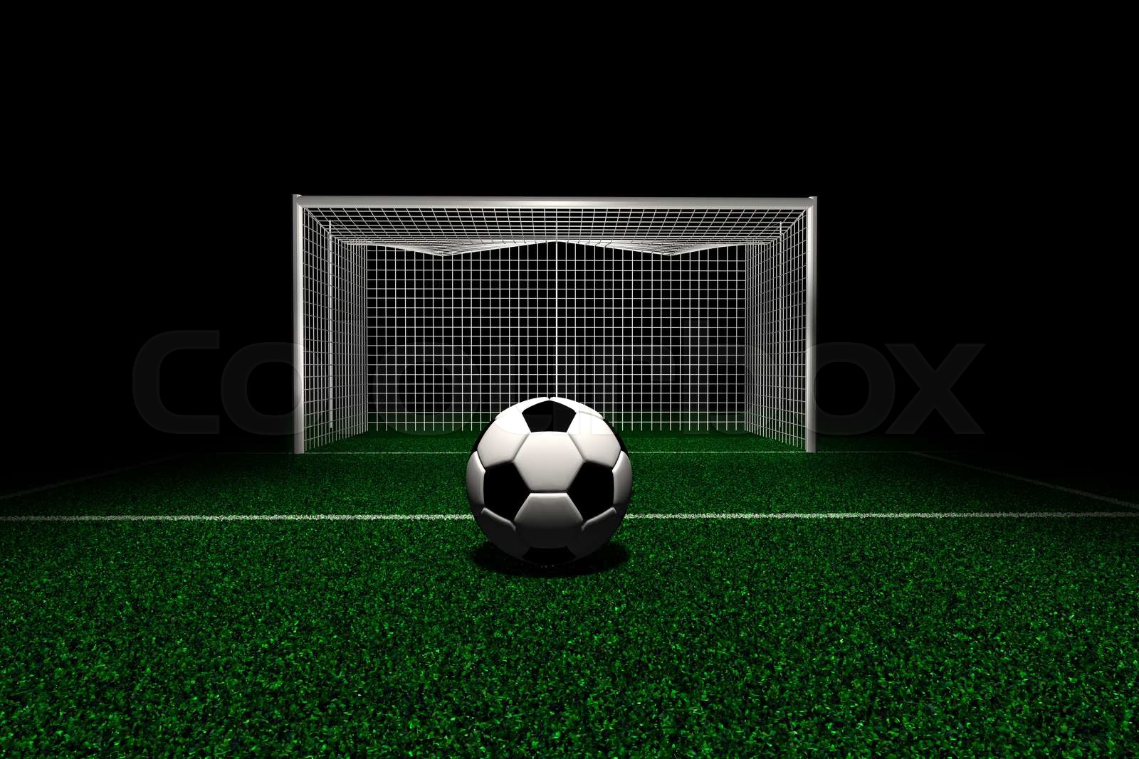 Soccer ball in front goal | Stock image | Colourbox