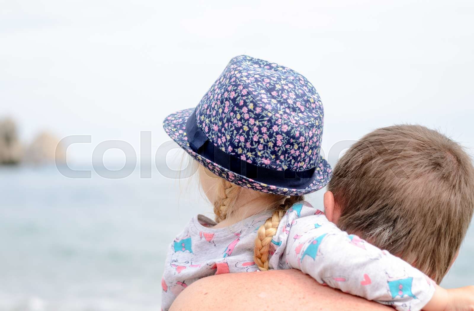 Rear View of Father and Daughter Looking at Water | Stock image | Colourbox