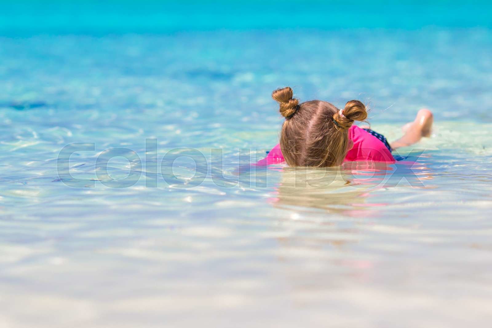Adorable little girl at beach during summer vacation | Stock image ...