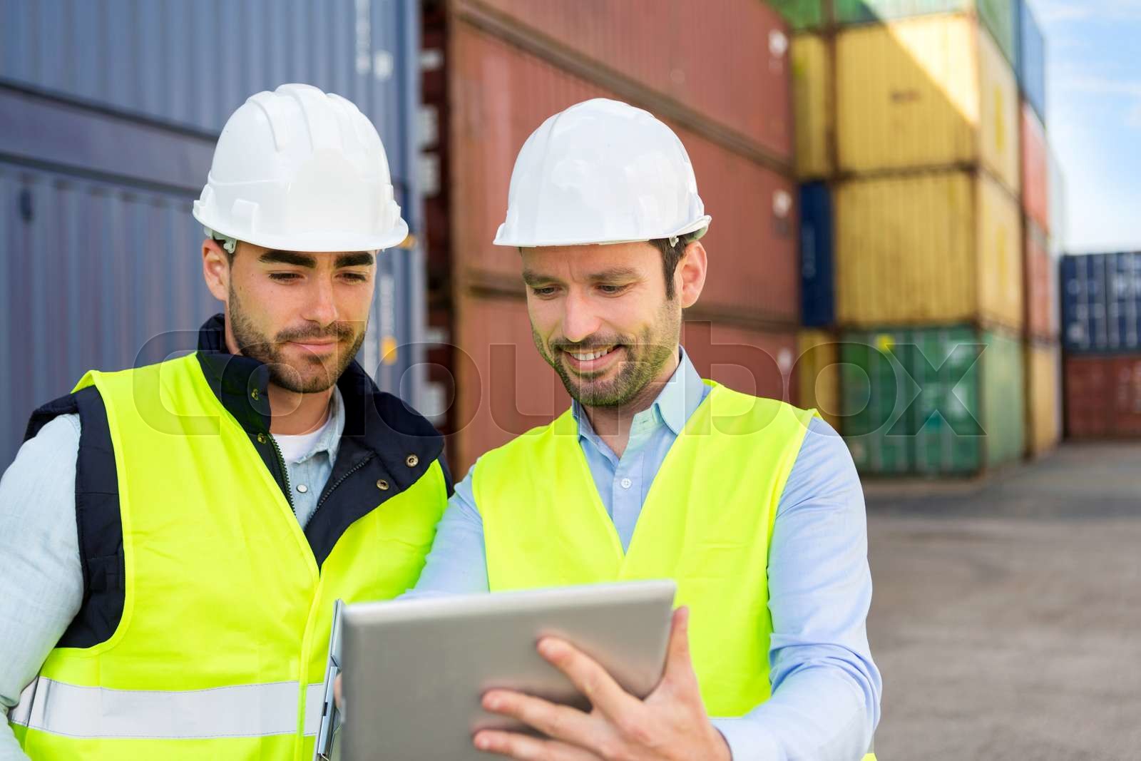 Two young attractives dockers working on the dock | Stock image | Colourbox