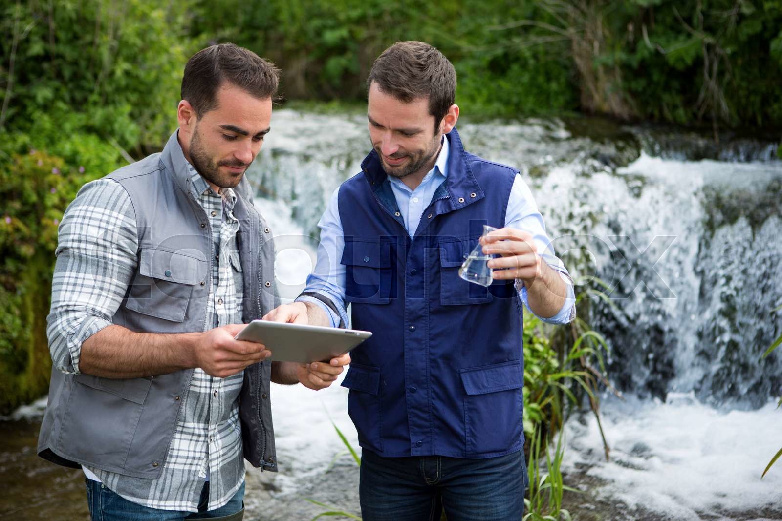 Scientist and biologist working together on water analysis | Stock ...