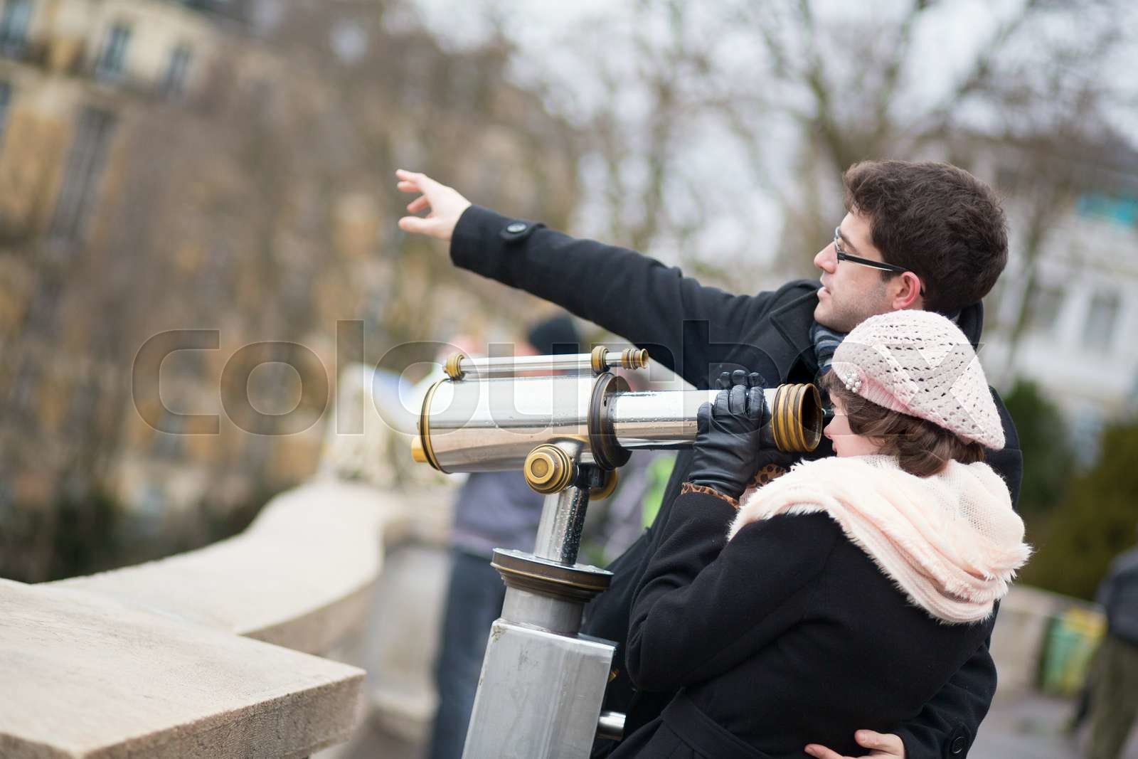Tourists using telescope for sightseeing | Stock image | Colourbox