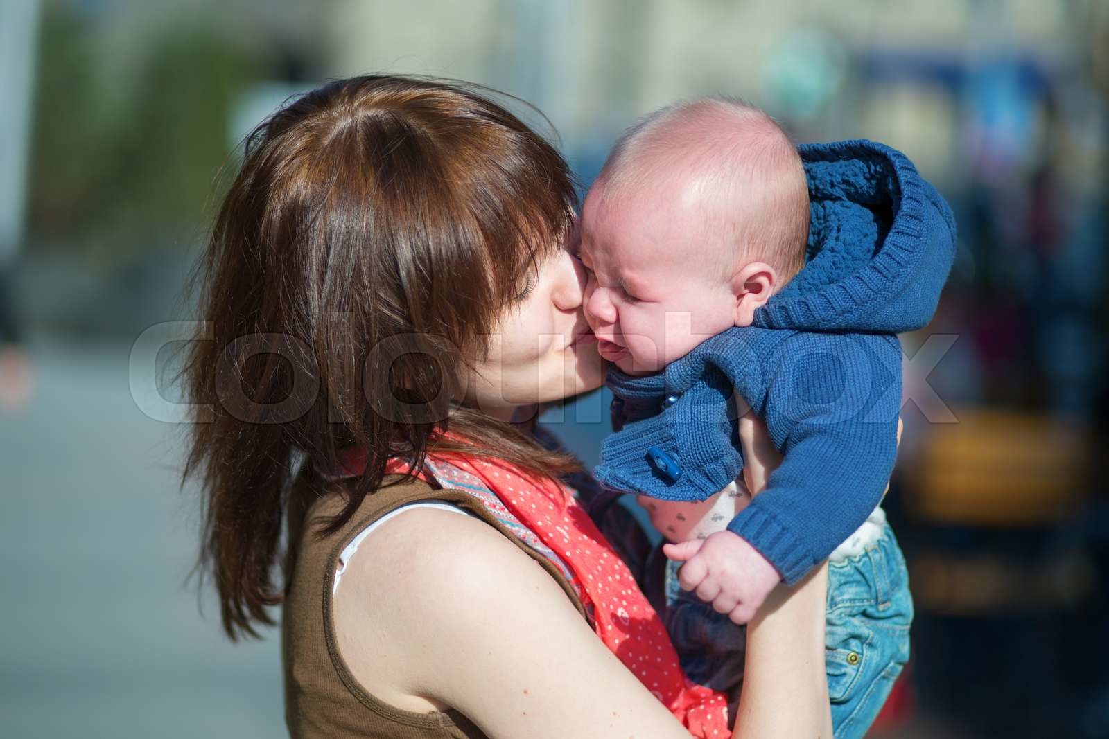 Young mother calming her crying baby | Stock image | Colourbox
