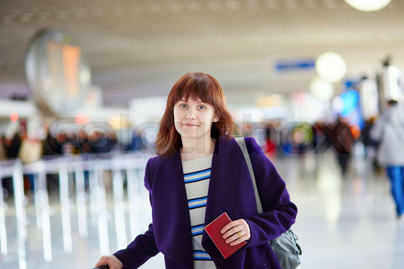 Beautiful young passenger at the airport | Stock image | Colourbox