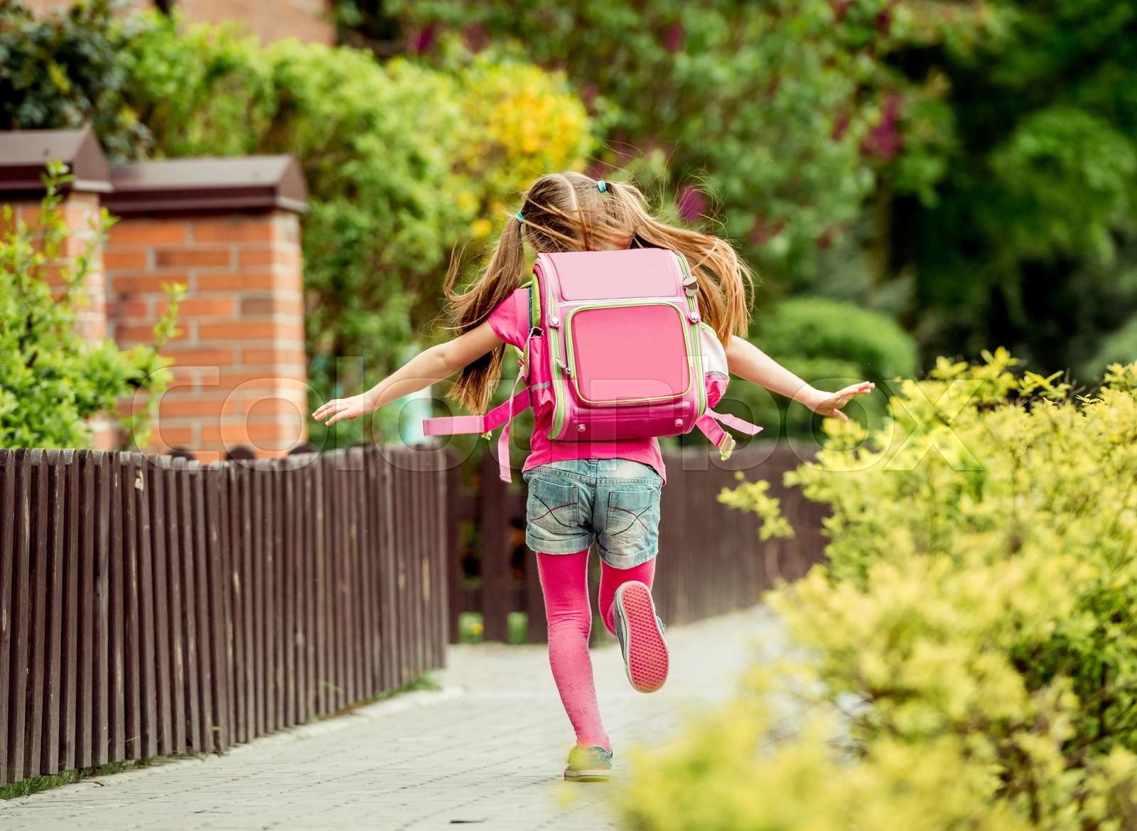 little girl run to school | Stock image | Colourbox