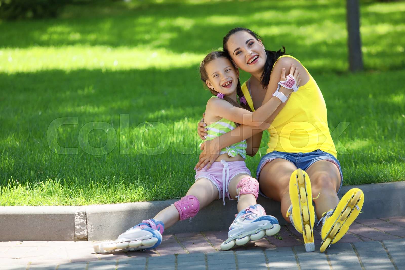 Rollerskaters mom and child | Stock image | Colourbox