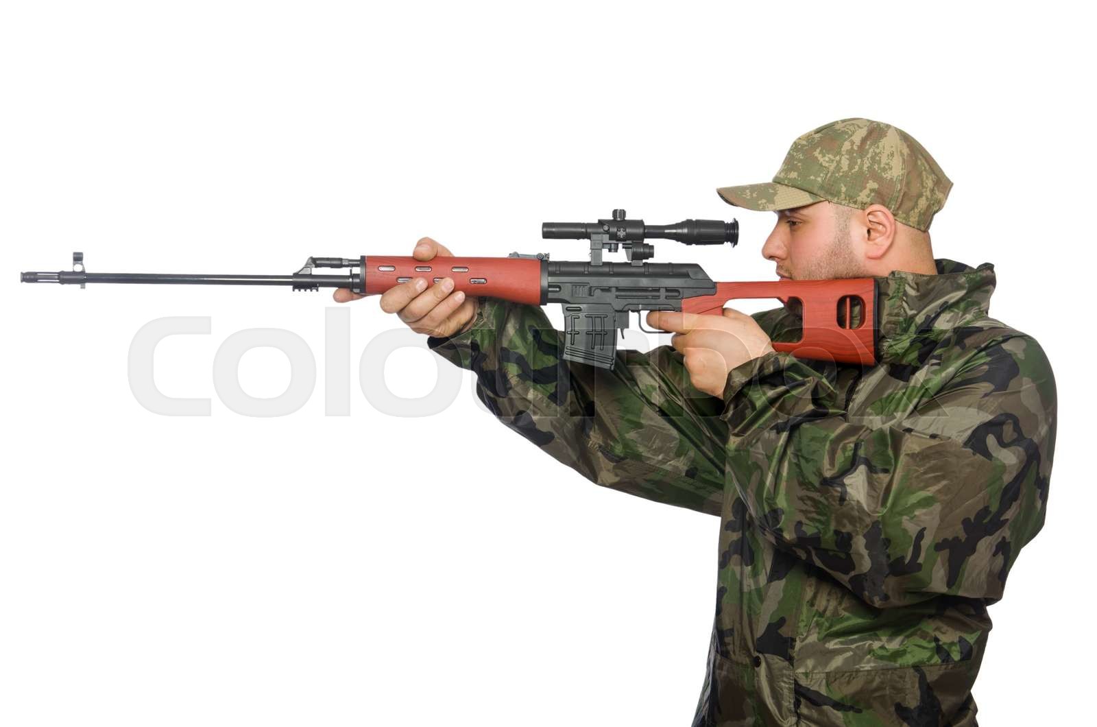 Solider holding gun isolated on white | Stock image | Colourbox