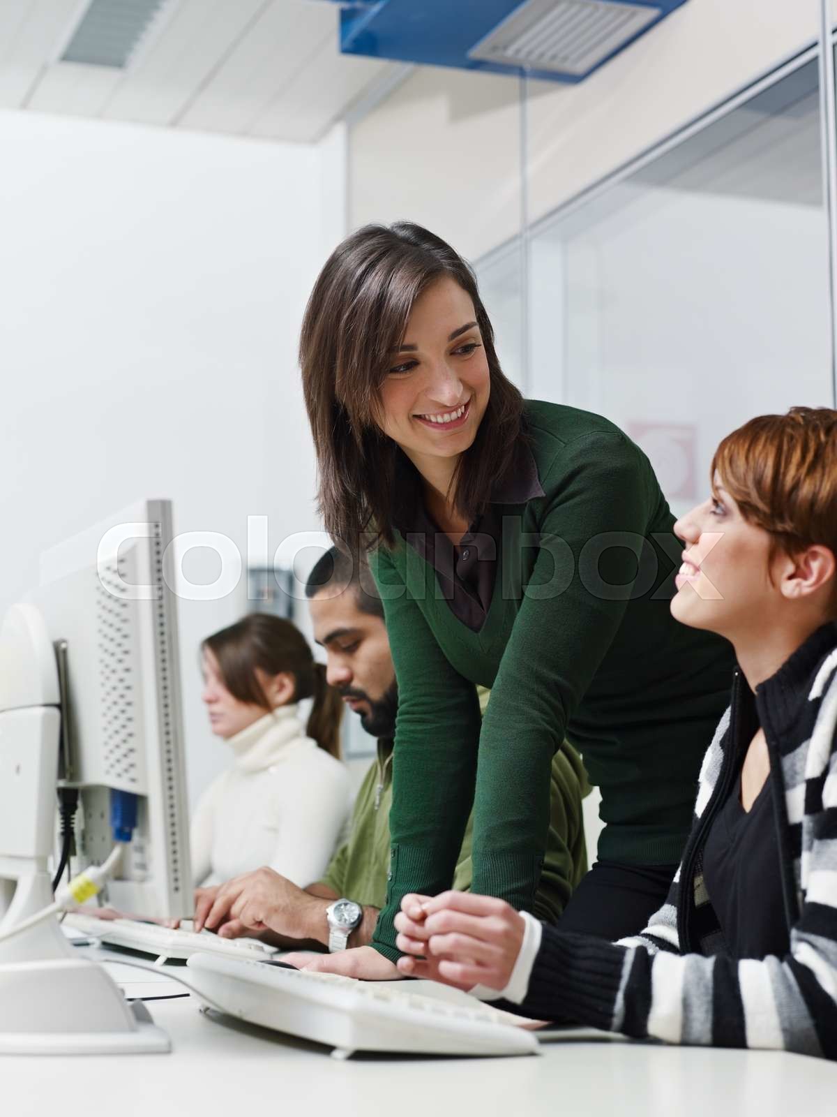 Teacher and students in college | Stock image | Colourbox