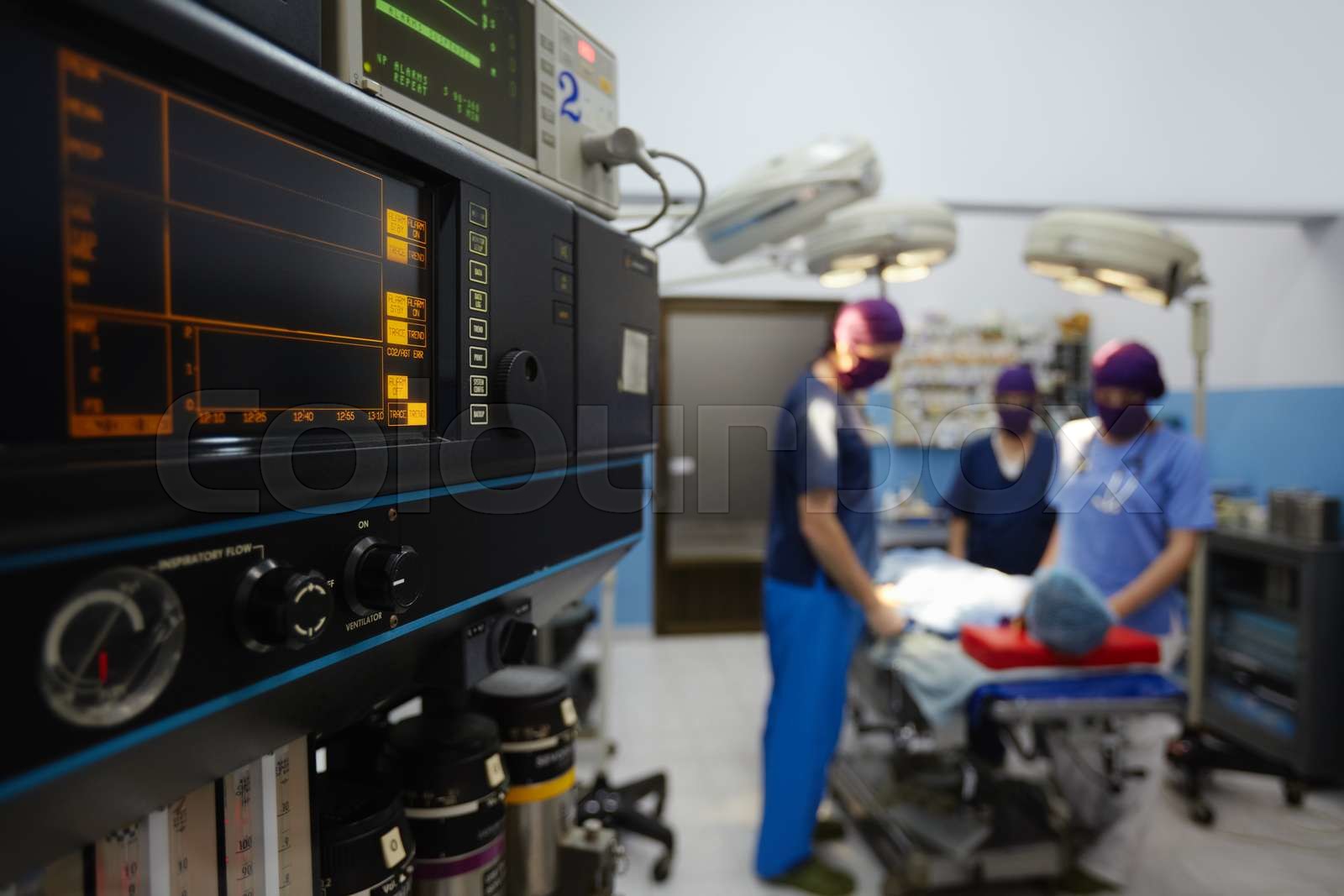 Operation room in clinic with medical staff during surgery | Stock ...