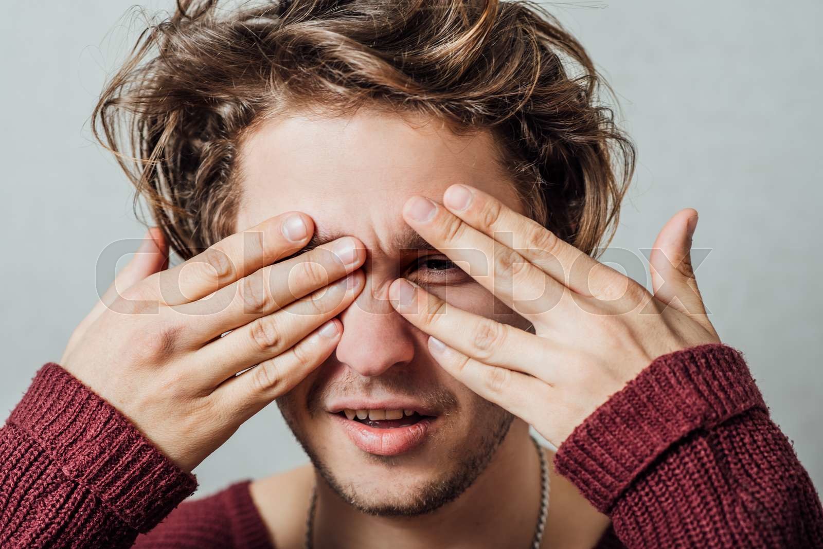 man closed one eye hand | Stock image | Colourbox