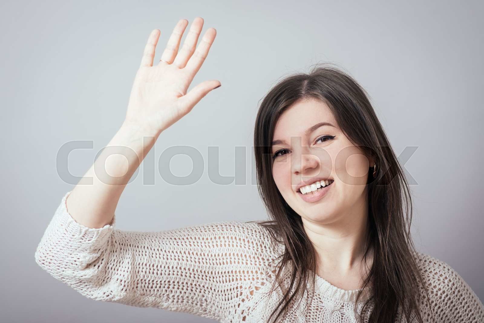 pretty girl waving | Stock image | Colourbox