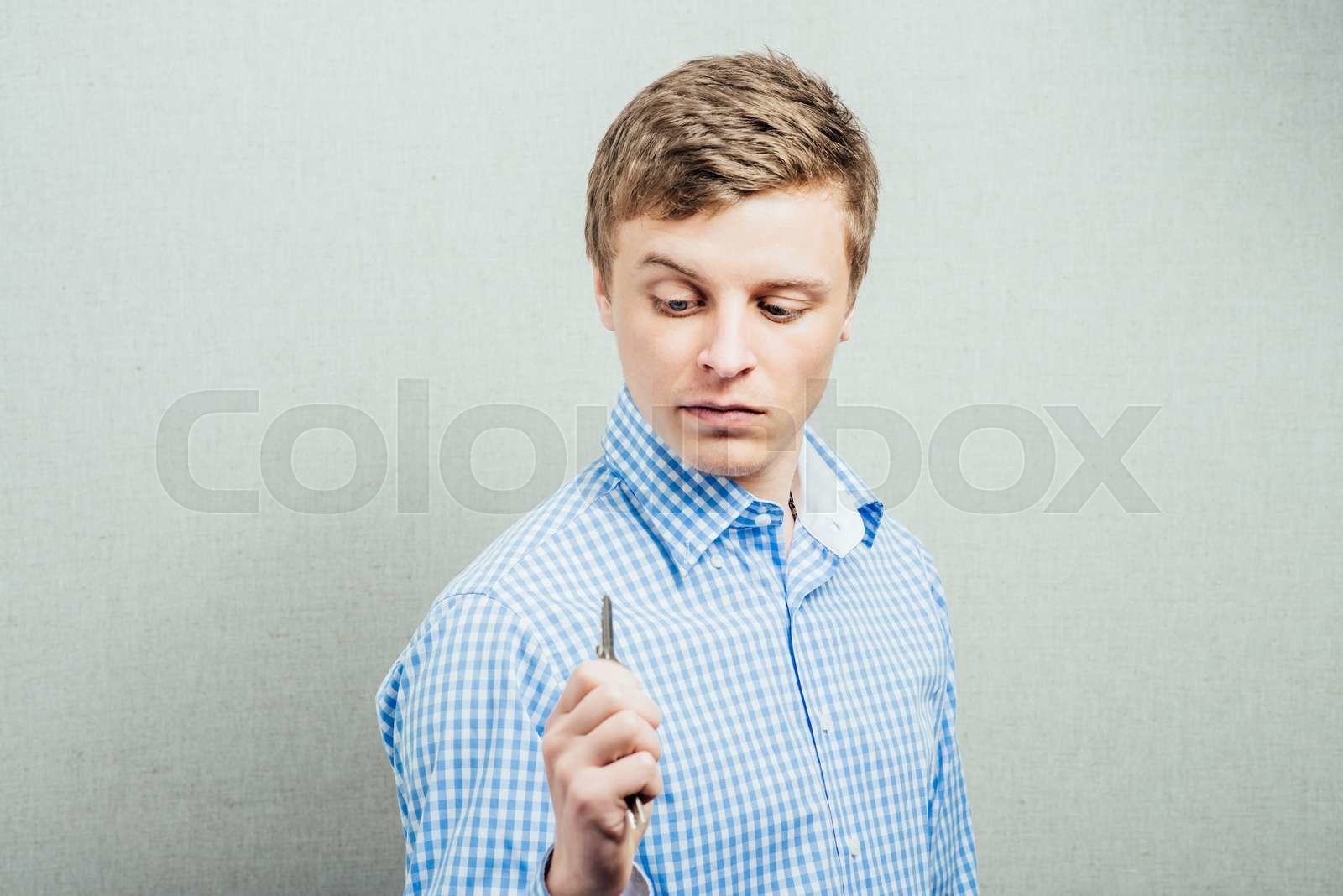 man holding keys | Stock image | Colourbox