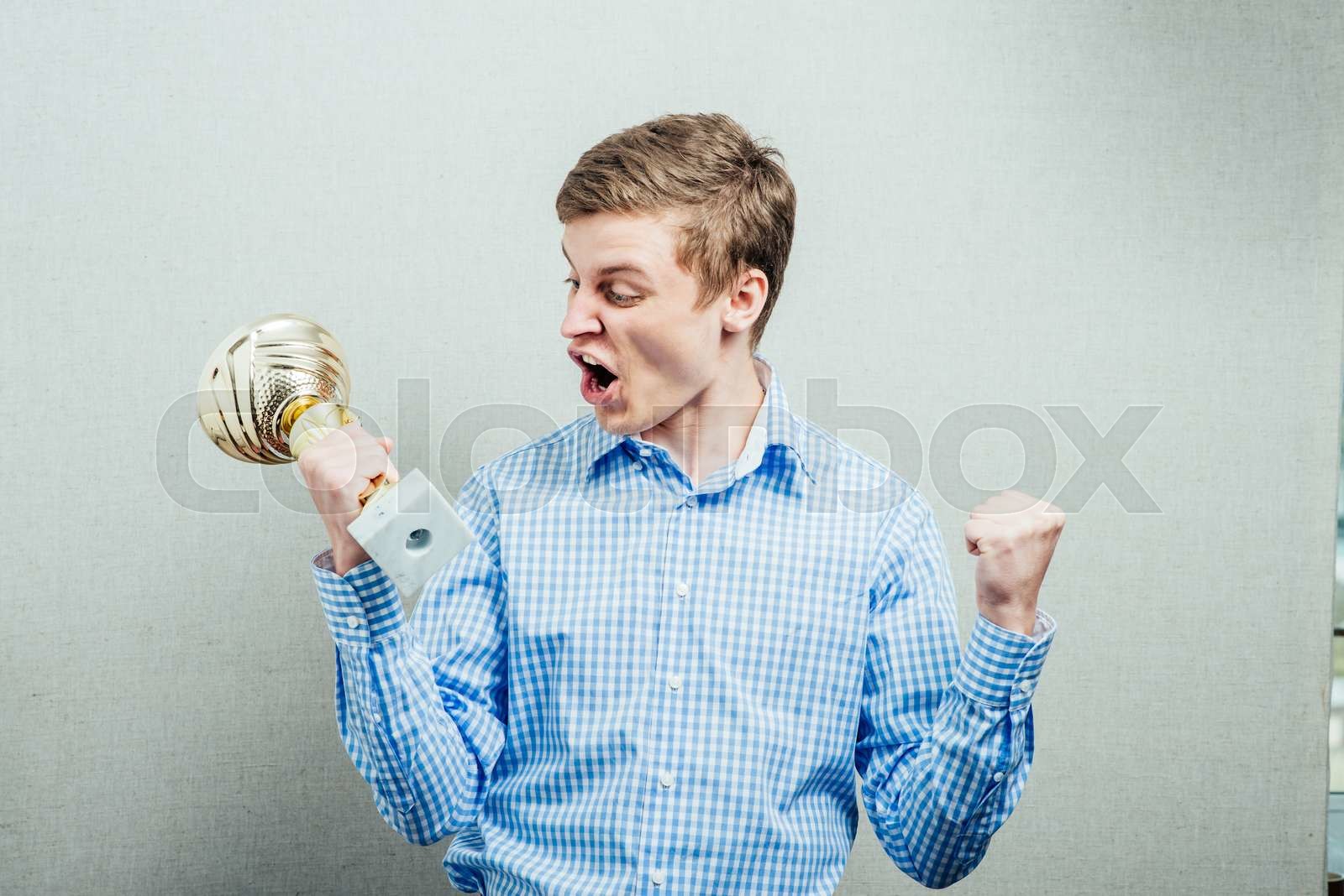 man with a prize trophy | Stock image | Colourbox