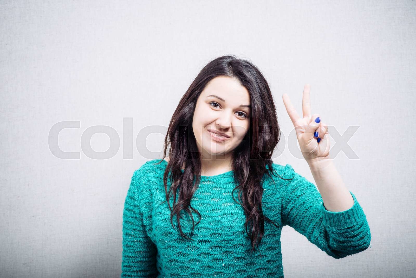 Beautiful Girl Show Victory Sign | Stock image | Colourbox