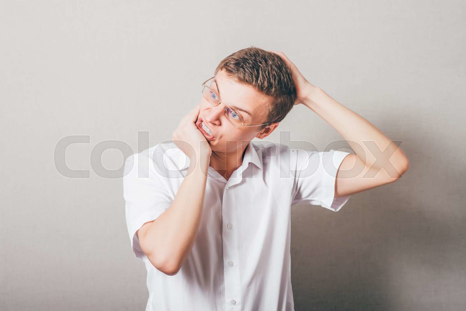 extremely shocked expressive guy with hands over his head | Stock image ...