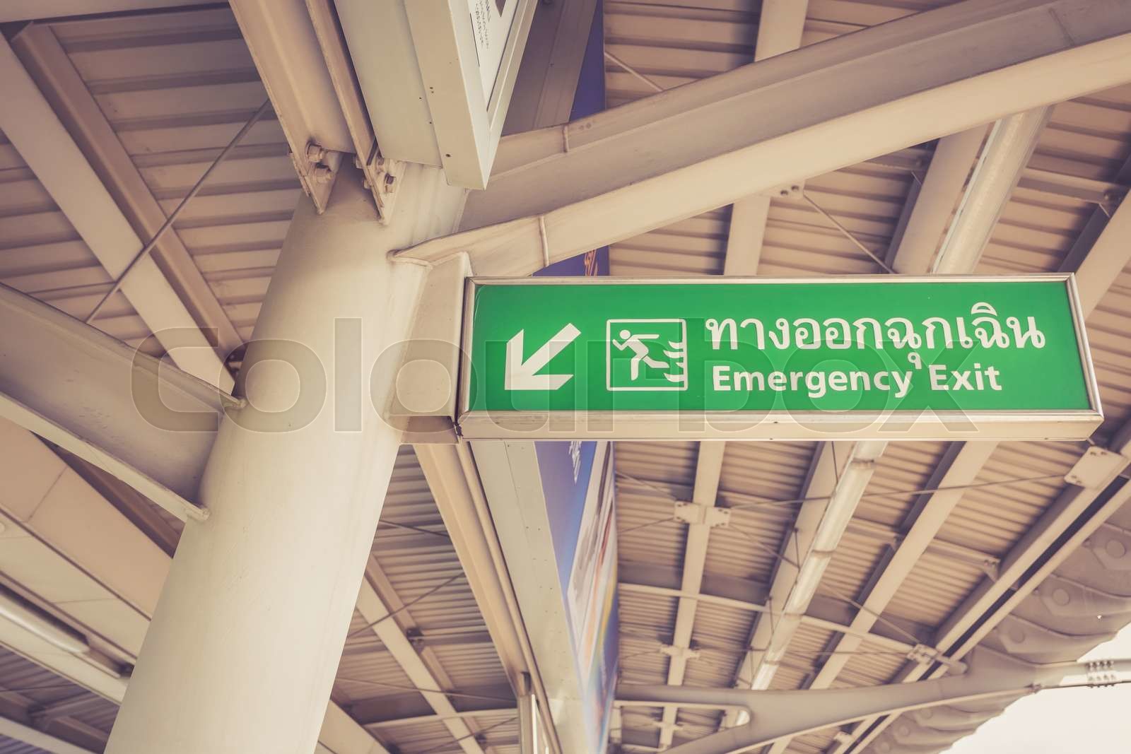 Emergency exit sign in skytrain station | Stock image | Colourbox