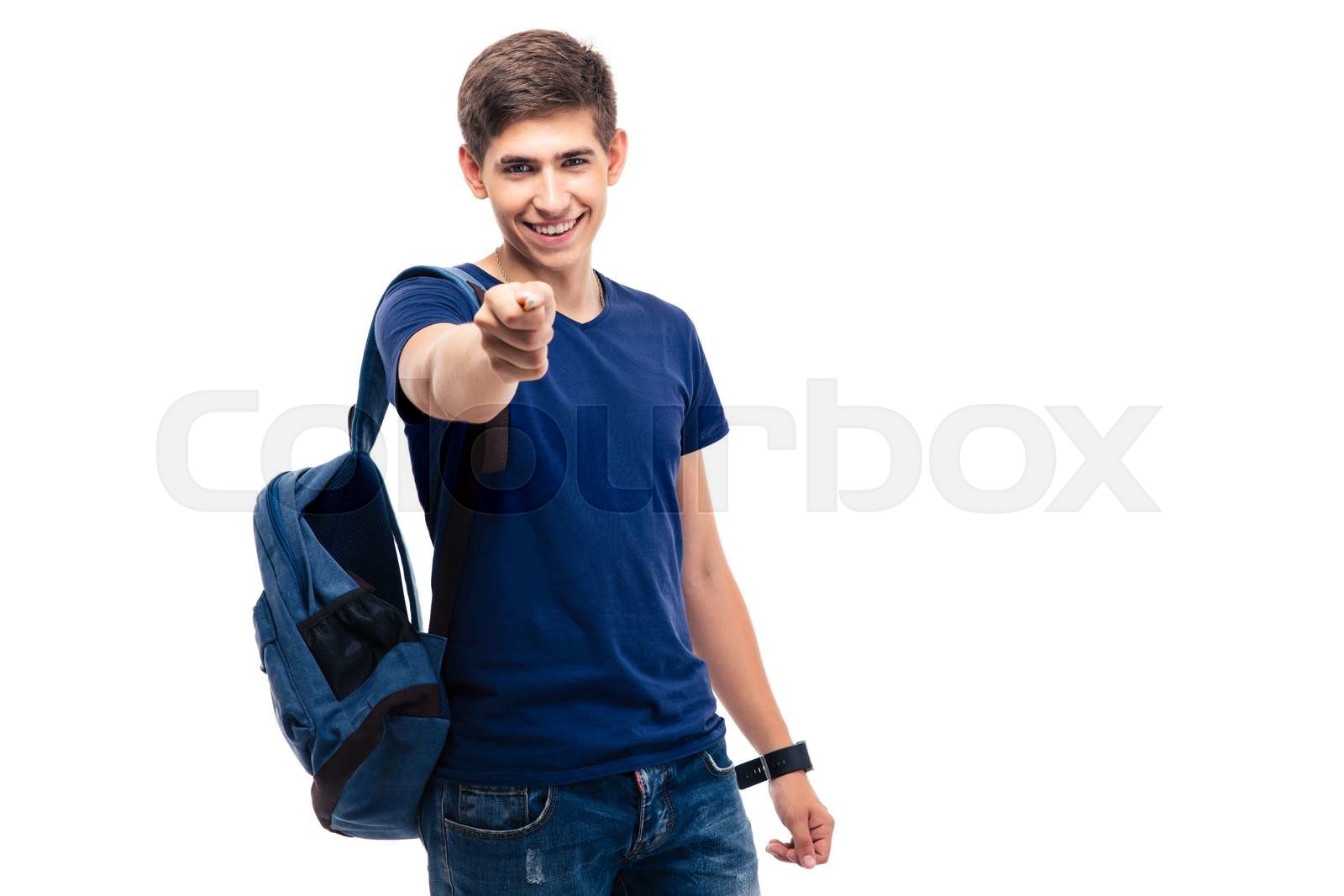 Smiling male student pointing at camera | Stock image | Colourbox