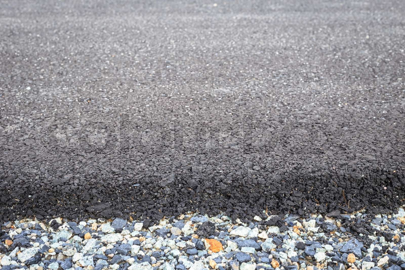 Close up rock and new asphalt road texture | Stock image | Colourbox