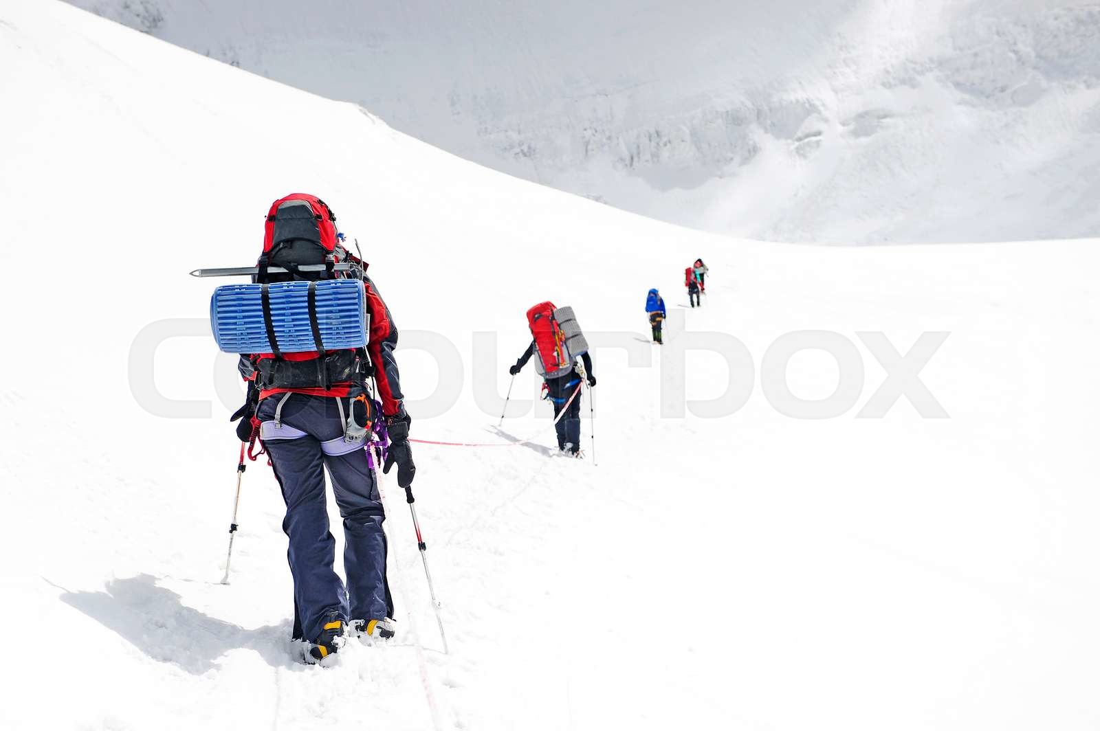Group of climbers reaching the summit | Stock image | Colourbox