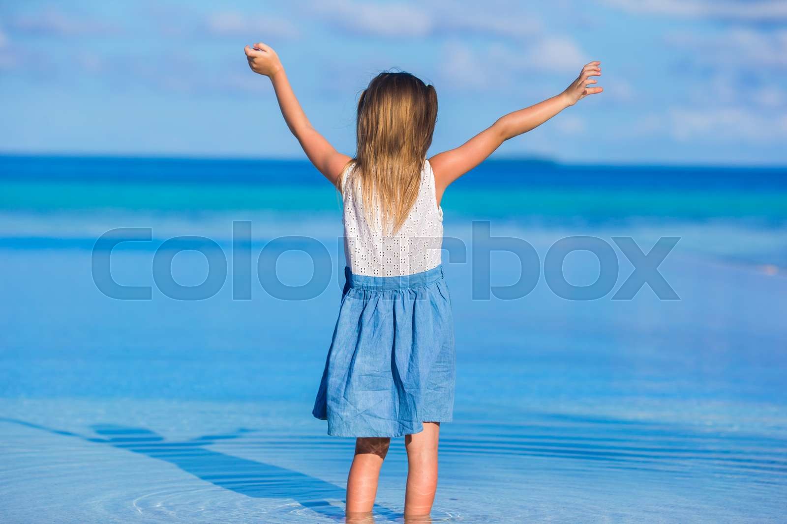 Adorable little girl at beach during summer vacation | Stock image ...