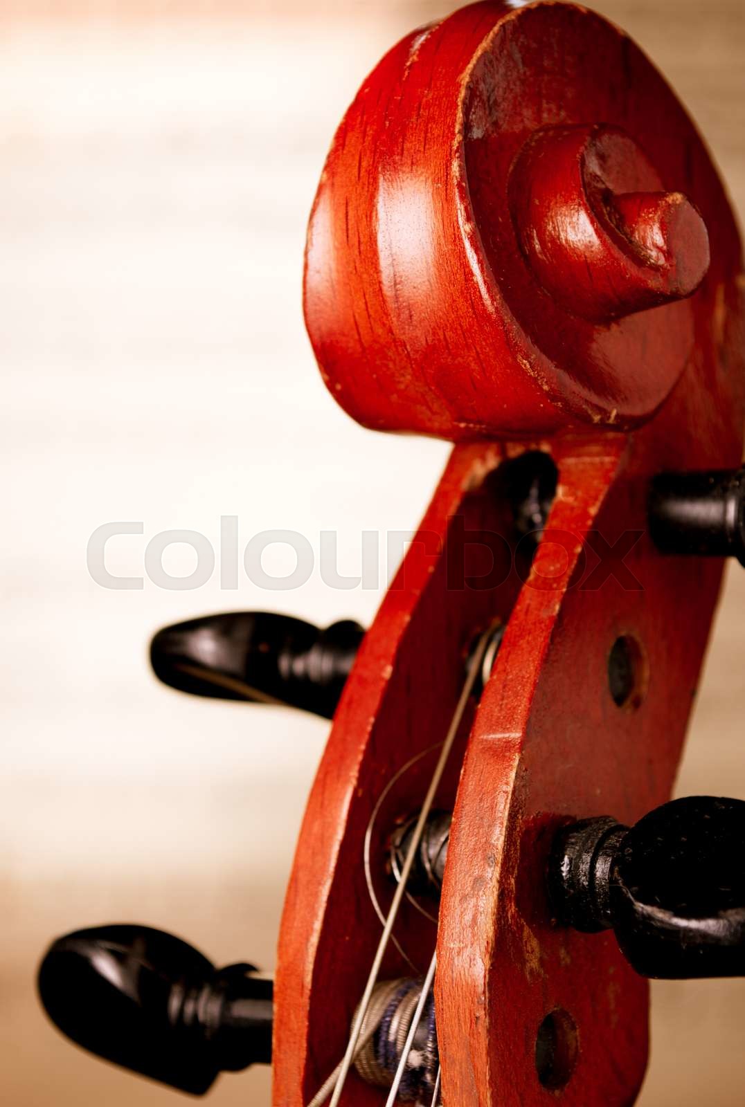 Close Up of Violin Scroll in front of Sheet Music | Stock image | Colourbox