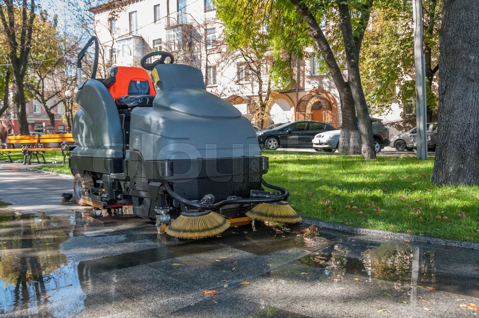 process of cleaning walkways in the Park machine | Stock image | Colourbox