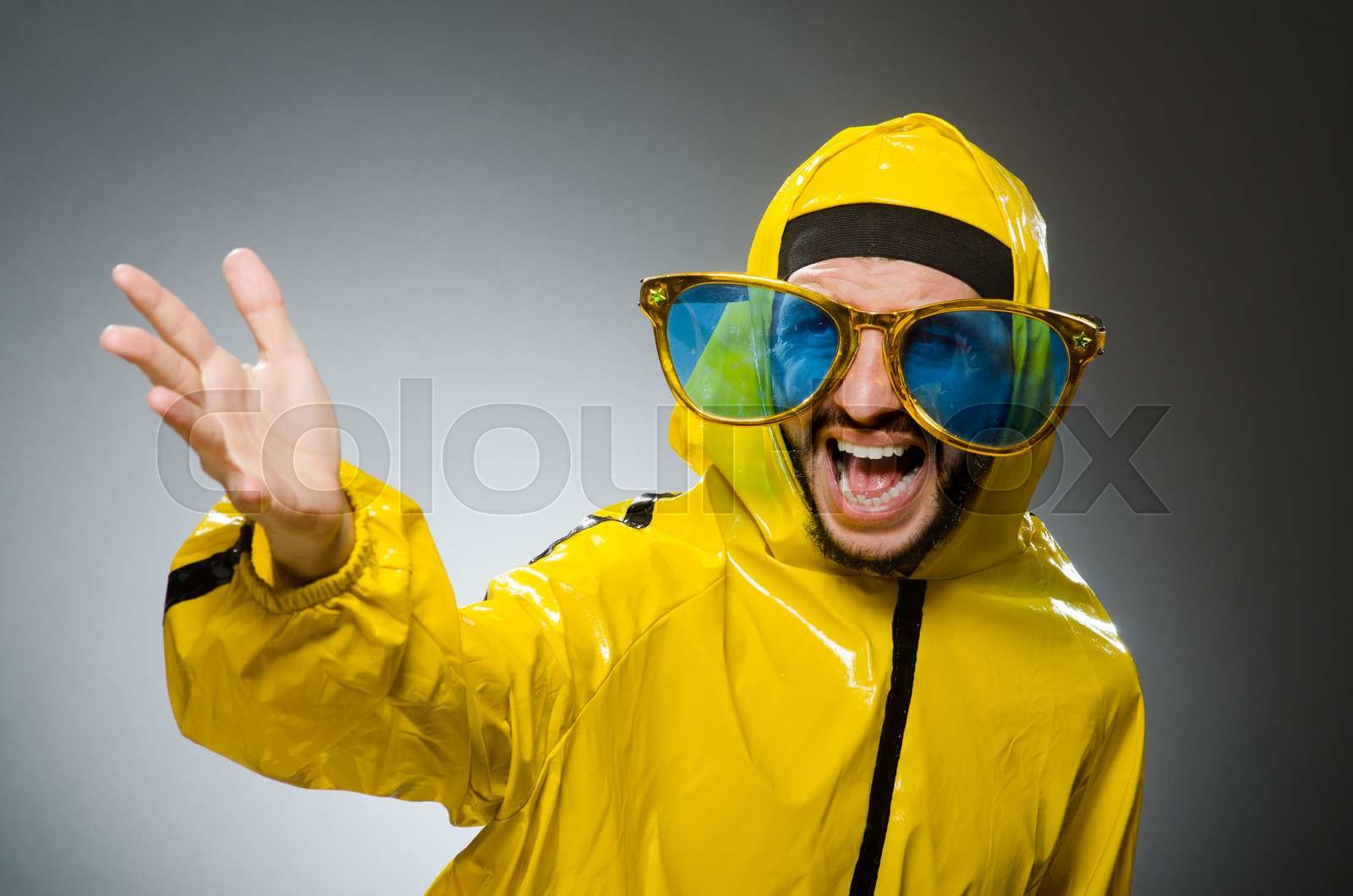 Man wearing yellow suit in funny concept | Stock image | Colourbox