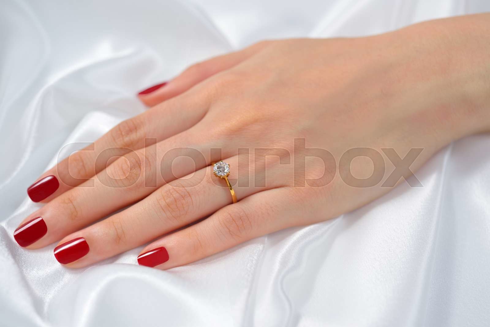 Wedding ring on hand | Stock image | Colourbox