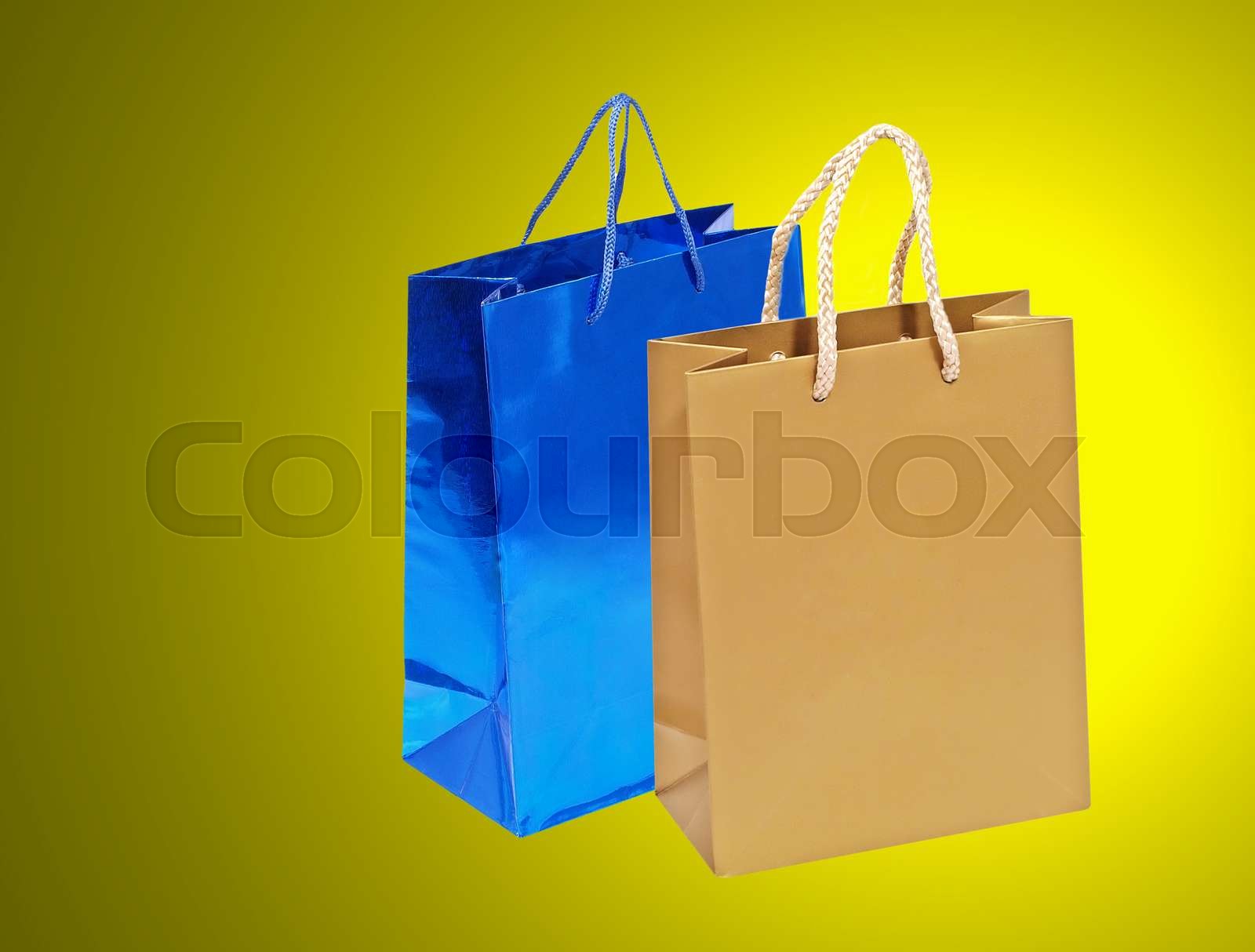 Blue and golden shopping bag. | Stock image | Colourbox