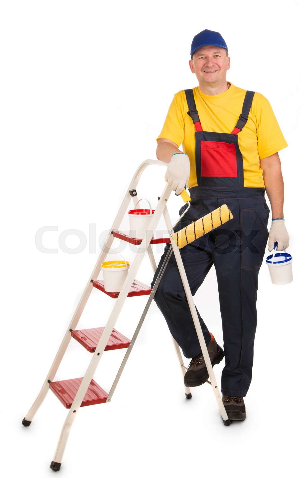 Worker on ladder with roller and bucket. | Stock image | Colourbox