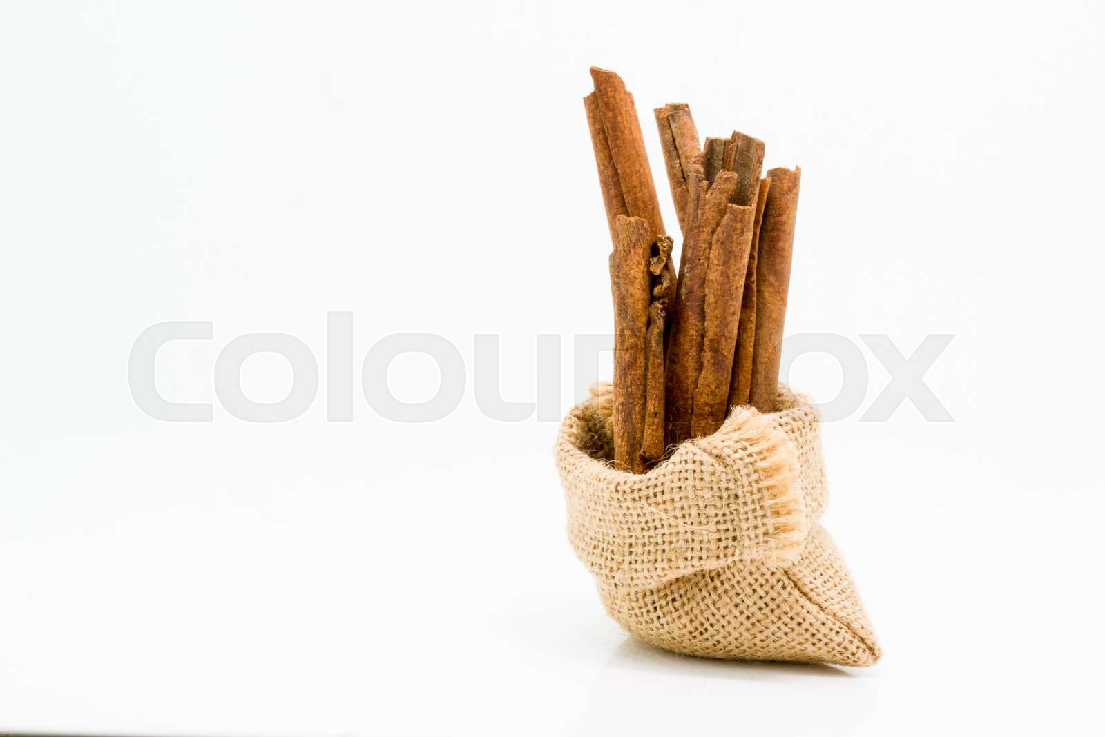 Cinnamon sticks in sack bag, | Stock image | Colourbox