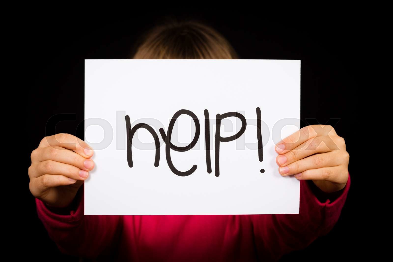 Child holding Help sign | Stock image | Colourbox