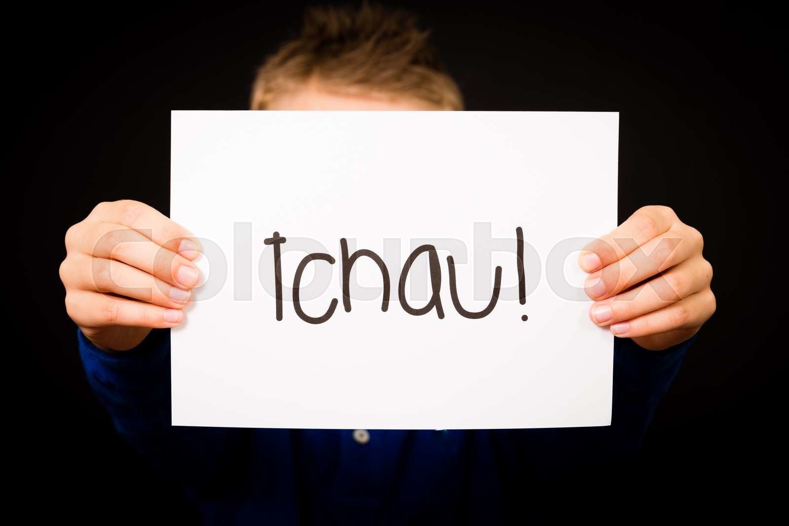 Child holding sign with Portuguese word Tchau - See You Later | Stock ...