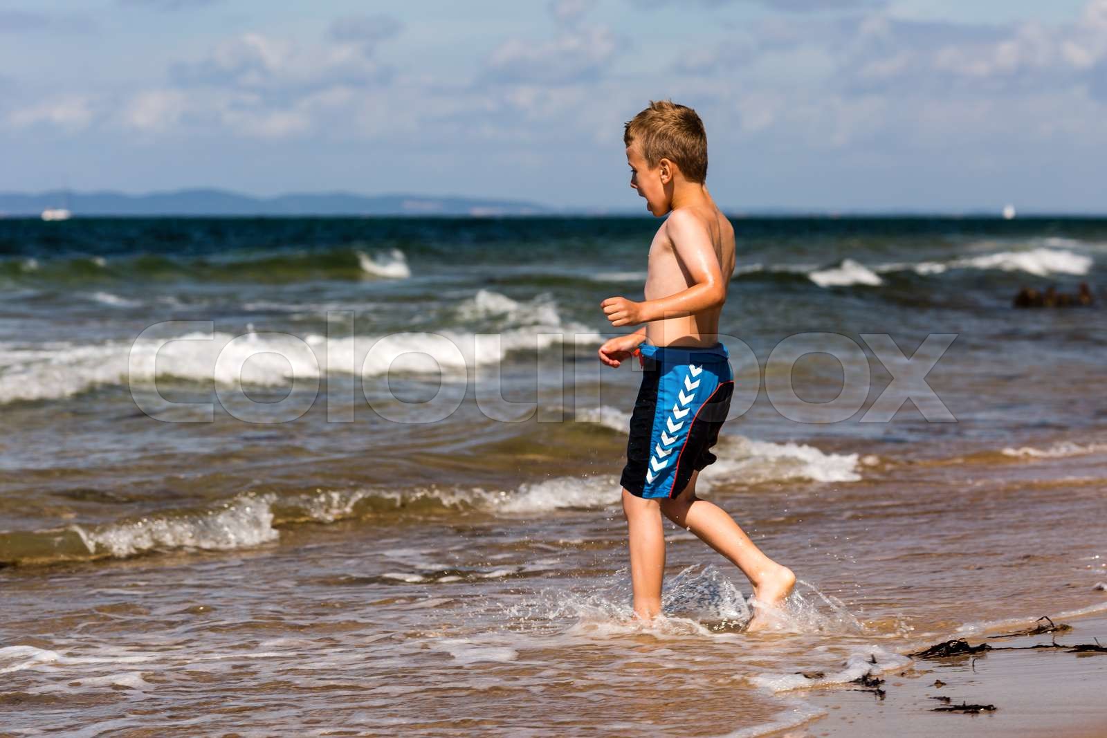 Boy at the beach | Stock image | Colourbox