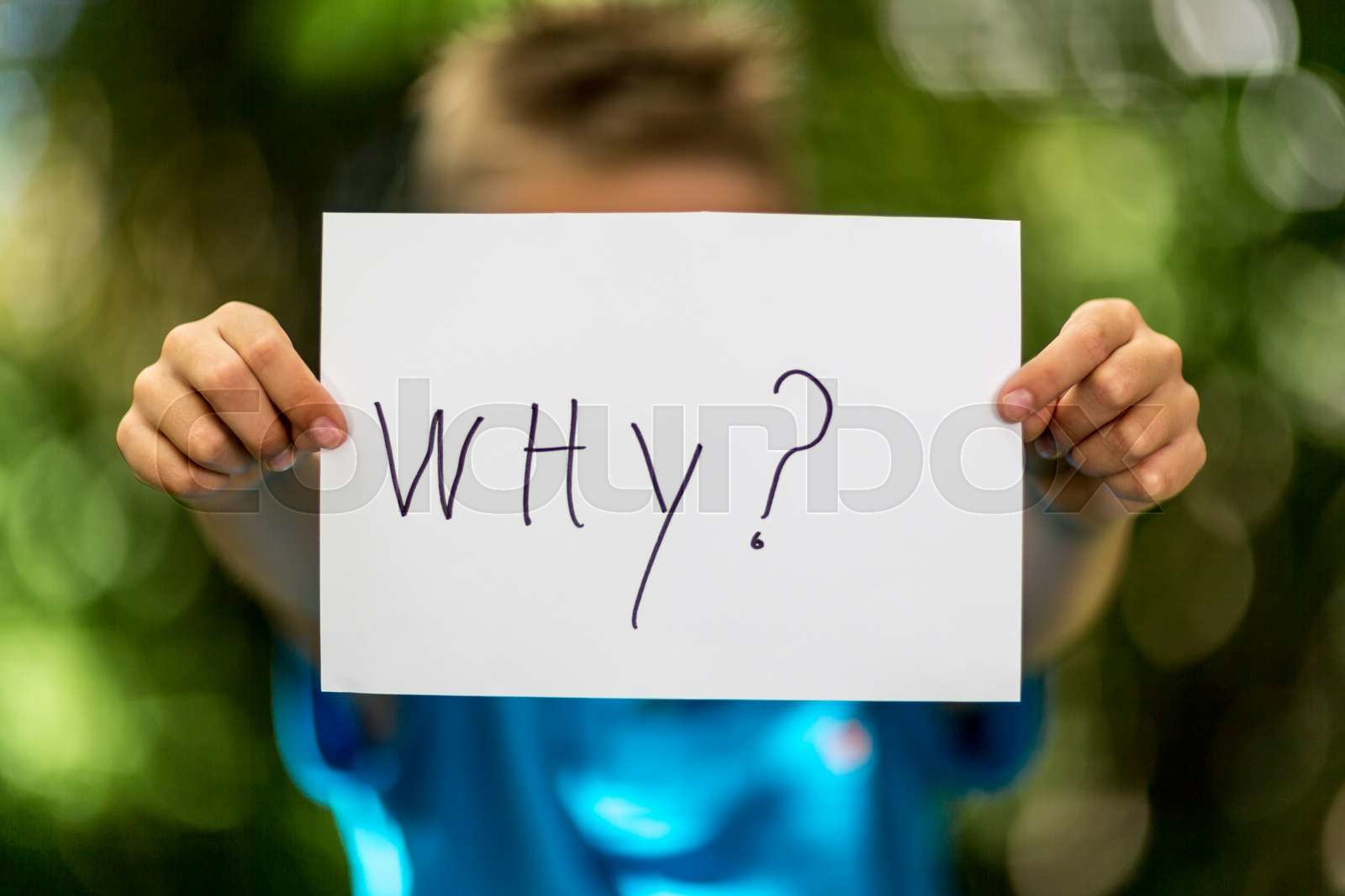 Boy with Why sign | Stock image | Colourbox